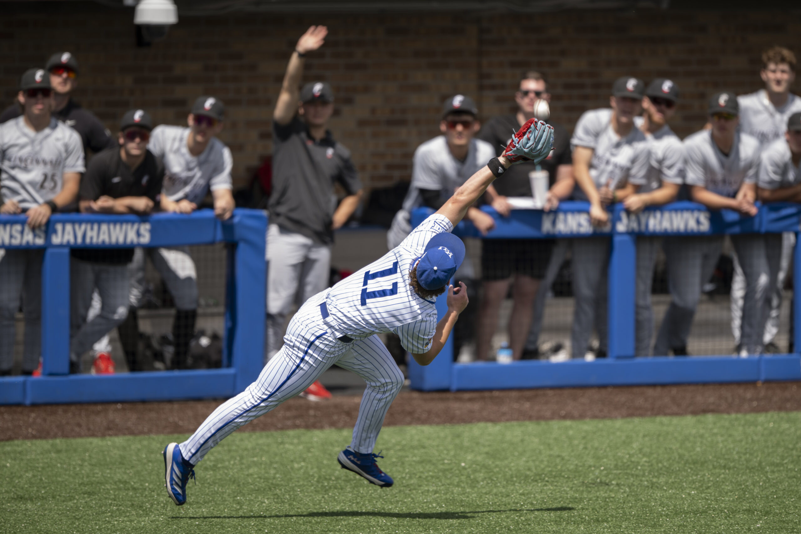 Once struck by lightning, Moore provides energy surge to KU pitching ...
